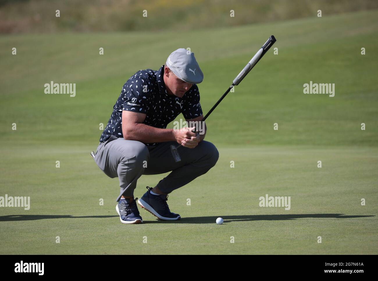 Sandwich, UK. 15th July, 2021. Bryson De Chambeau of USA looks at his ...