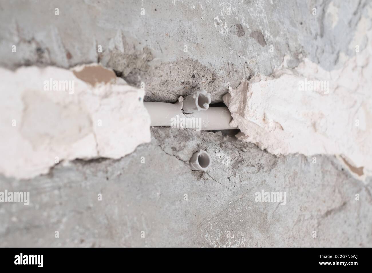 Damaged wiring cable. Drill a hole in the wiring Stock Photo - Alamy