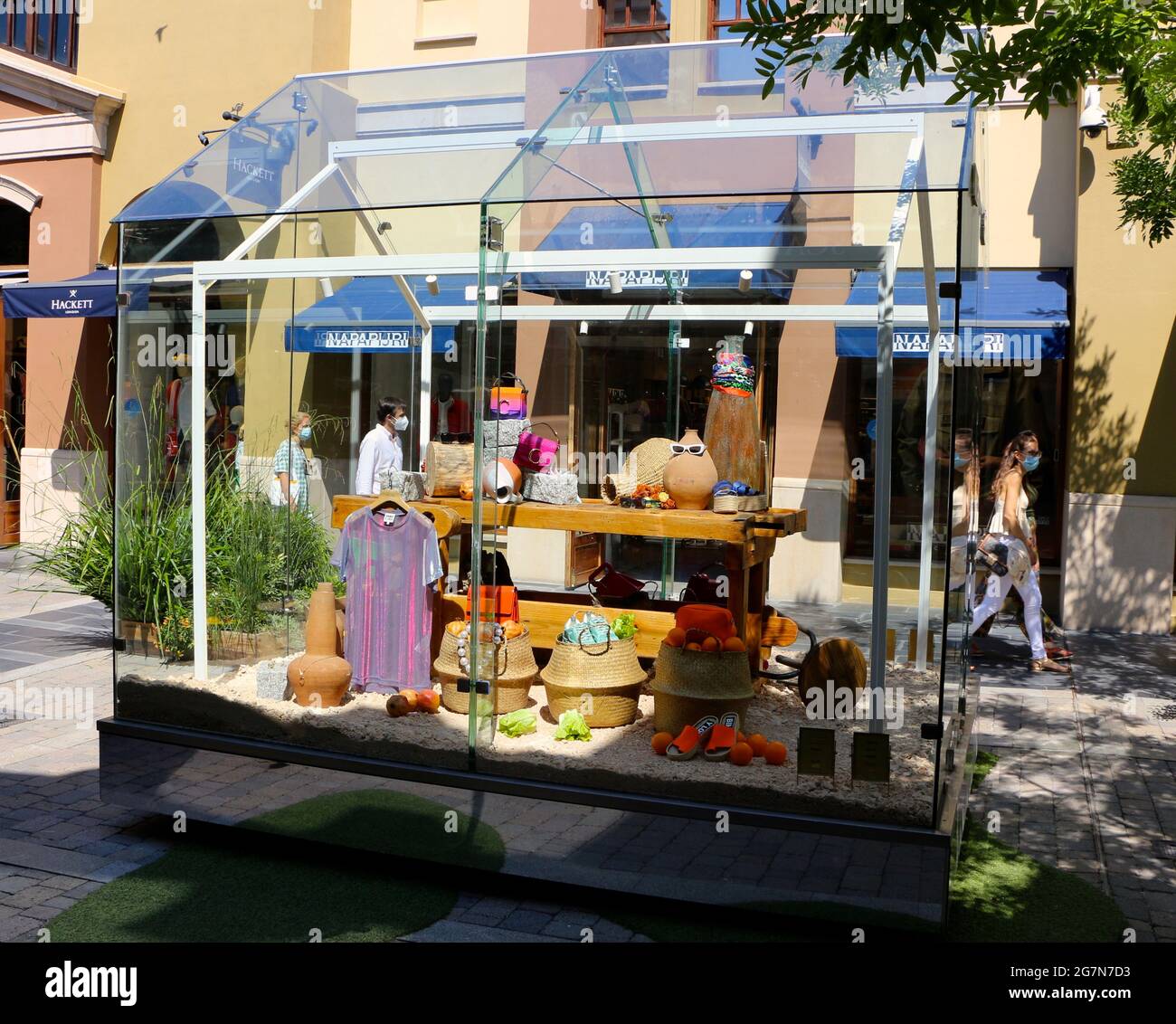 Perspex enclosed display of fashion items Las Rozas open air outlet ...