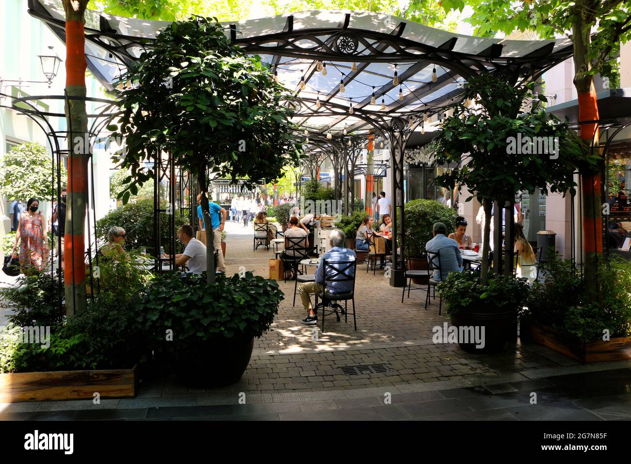 Open air restaurant terrace covered with a canopy and with water vapour ...