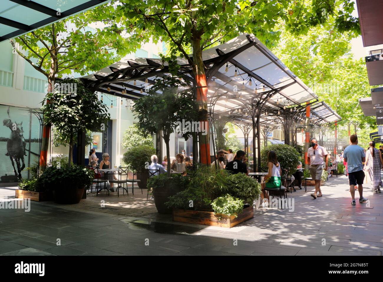 Open air restaurant terrace covered with a canopy and with water vapour ...