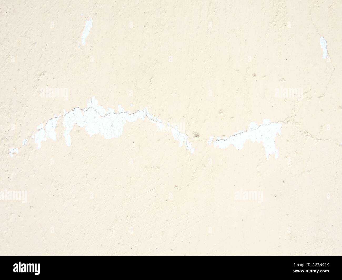 Old empty cream wall with white crack. Cream background Stock Photo - Alamy