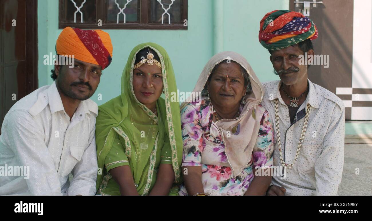 Group of South Asian people in traditional Indian clothing posing ...