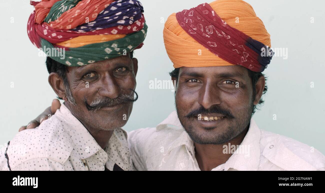 Pair of smiling happy South Asian males in traditional clothing Stock ...