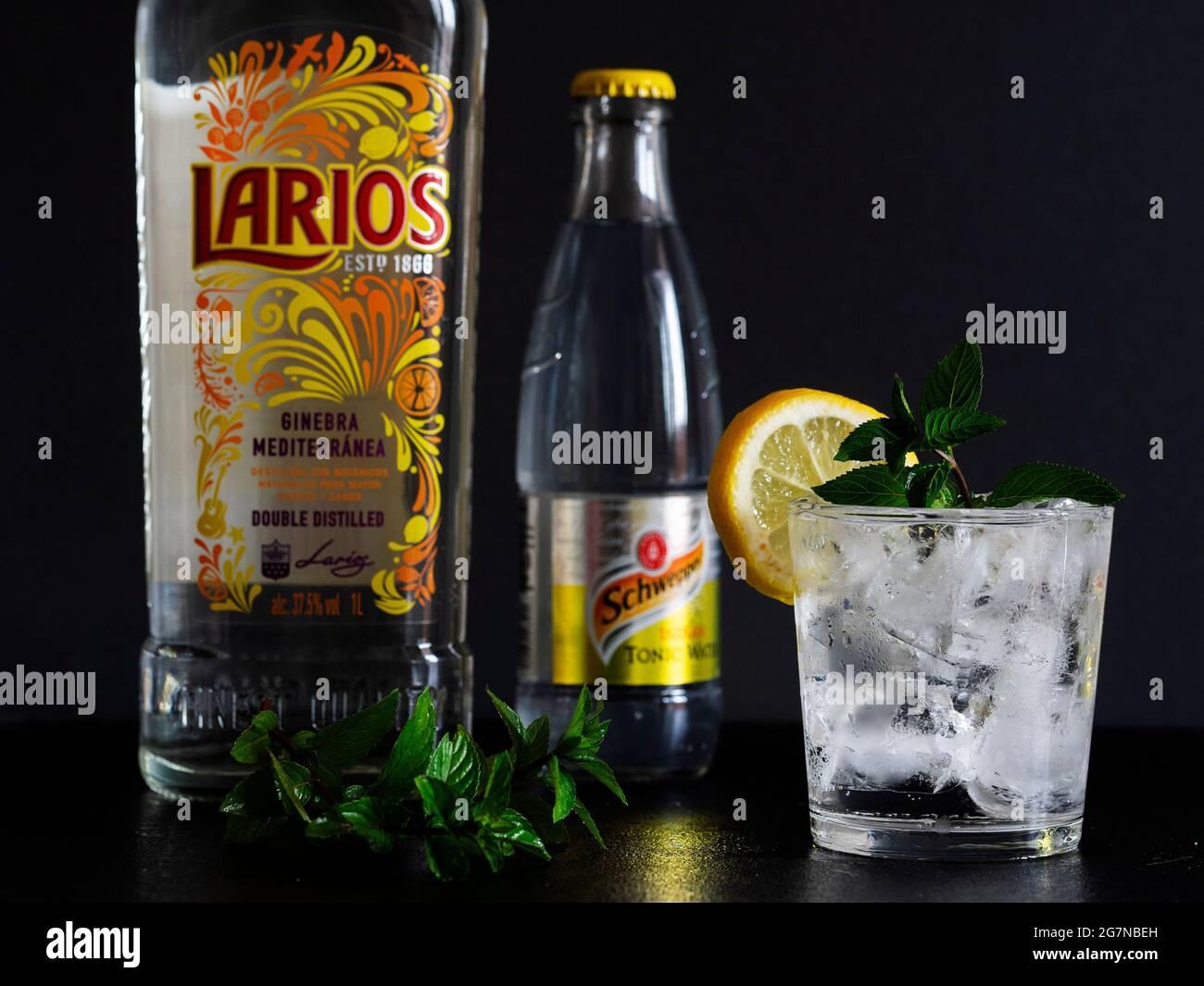 In this photo illustration, bottles of gin Larios and Schweppes Indian ...
