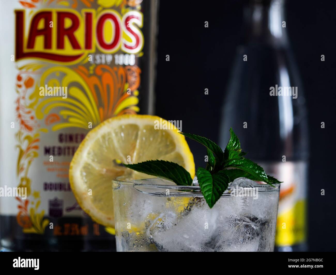 In this photo illustration, a bottle of gin Larios ready-made drink ...