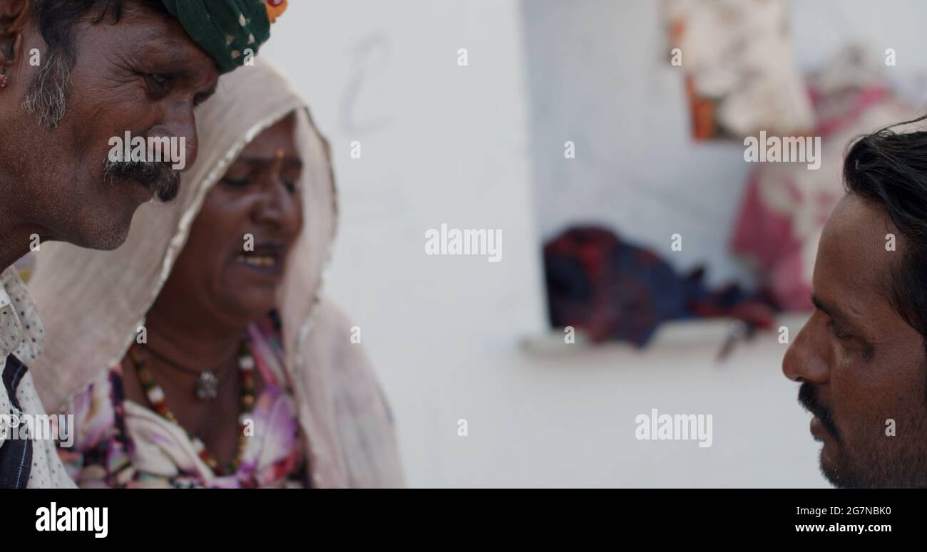 Group of indians having a conversation outdoors Stock Photo - Alamy
