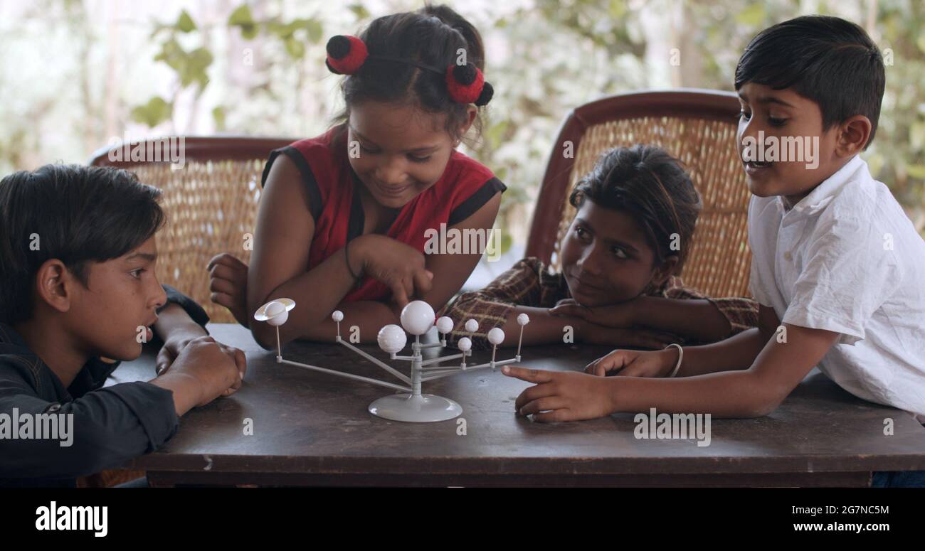 Indian kids having fun while making a constructor outdoors Stock Photo ...