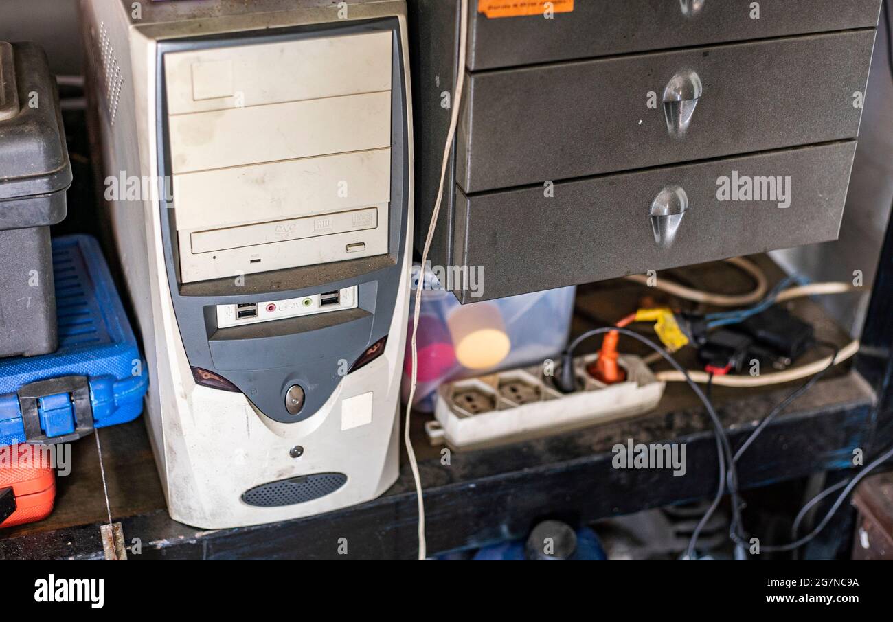Detail of Old junk computer under a table Stock Photo - Alamy