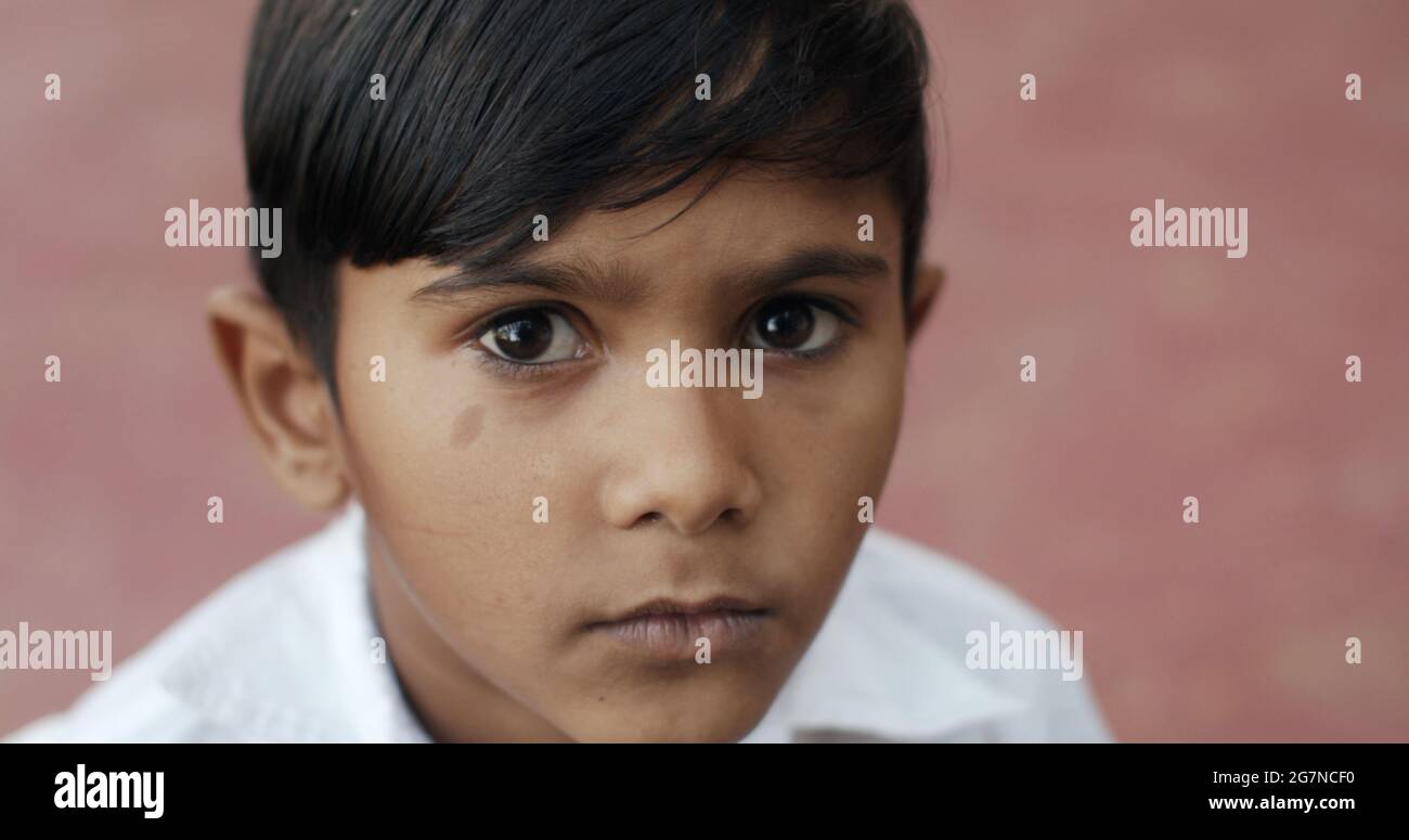 Portrait of an Indian boy looking seriously Stock Photo - Alamy