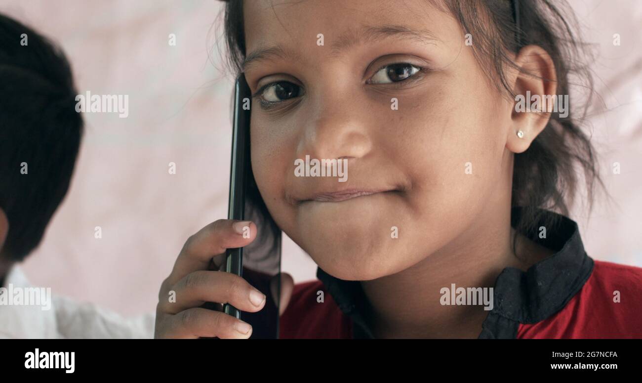 Closeup of an Indian girl talking over the phone Stock Photo - Alamy