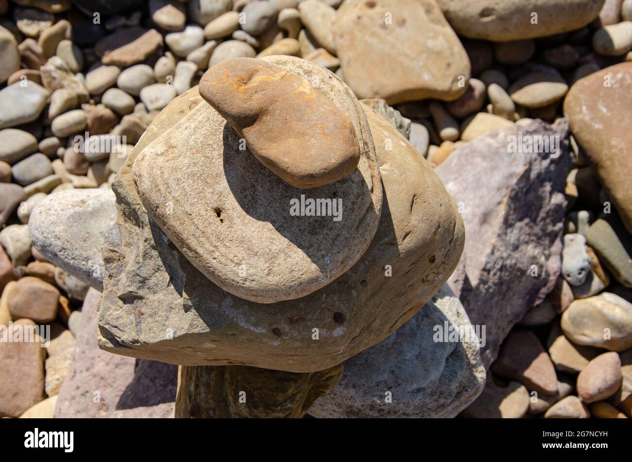 Cairns built by visitors to Lindisfarne Castle on Holy Island, off the ...