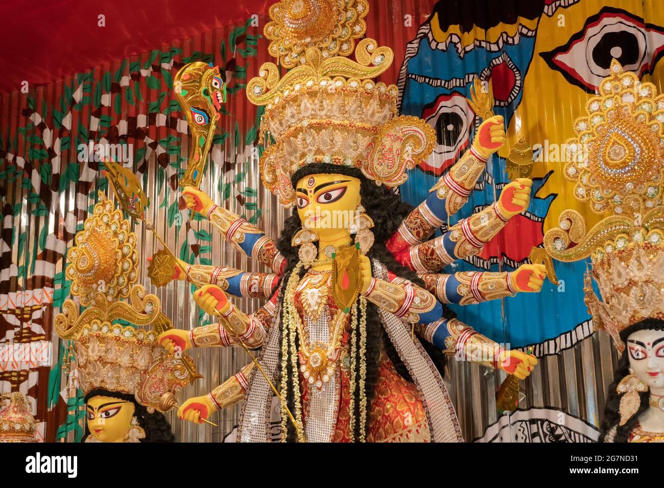 Goddess Durga idol at decorated Durga Puja pandal, shot at colored ...