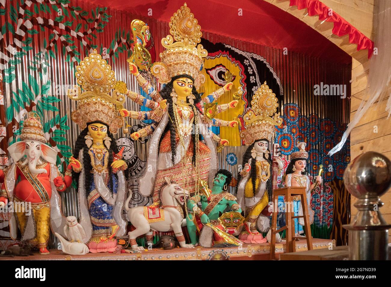 Goddess Durga idol at decorated Durga Puja pandal, shot at colored ...
