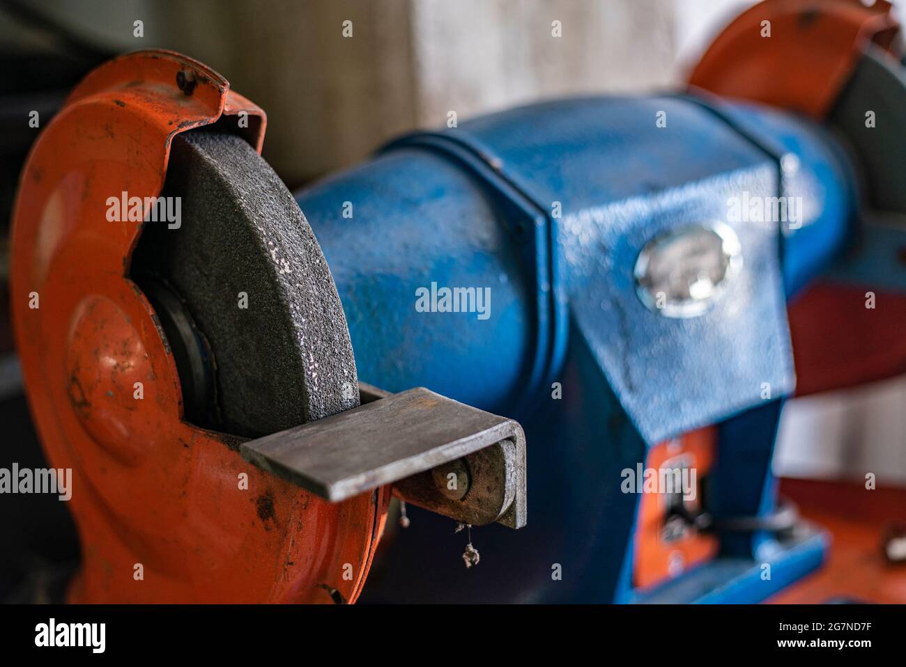 Blue Grinding machine detail in a workshop Stock Photo - Alamy