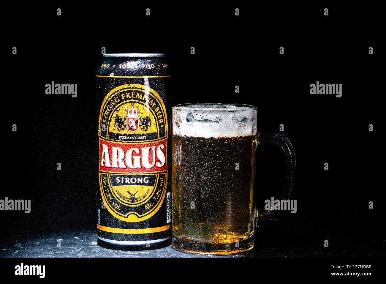 Can of Argus beer and beer glass on dark background. Illustrative ...