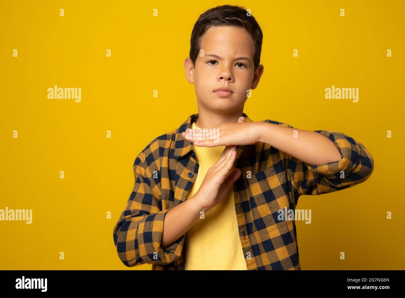 Young handsome little boy standing over isolated background. Has ...