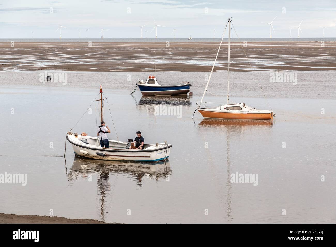 Fishing boats at low tide on the foreshore, Meols, Wirral, UK Stock ...