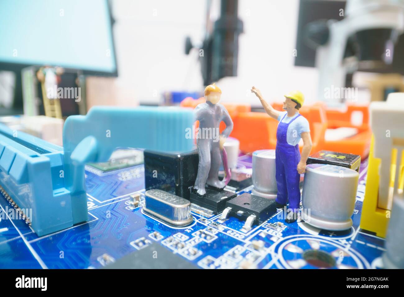 Miniature repair man on mainboard, Miniature figure of worker team try ...