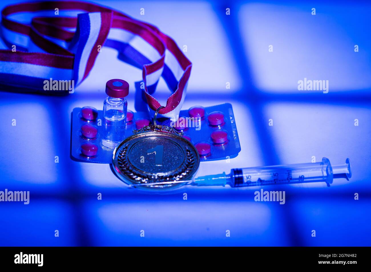 Champion gold medal, syringe with doping substance, pill tablet and vial with prohibited ...
