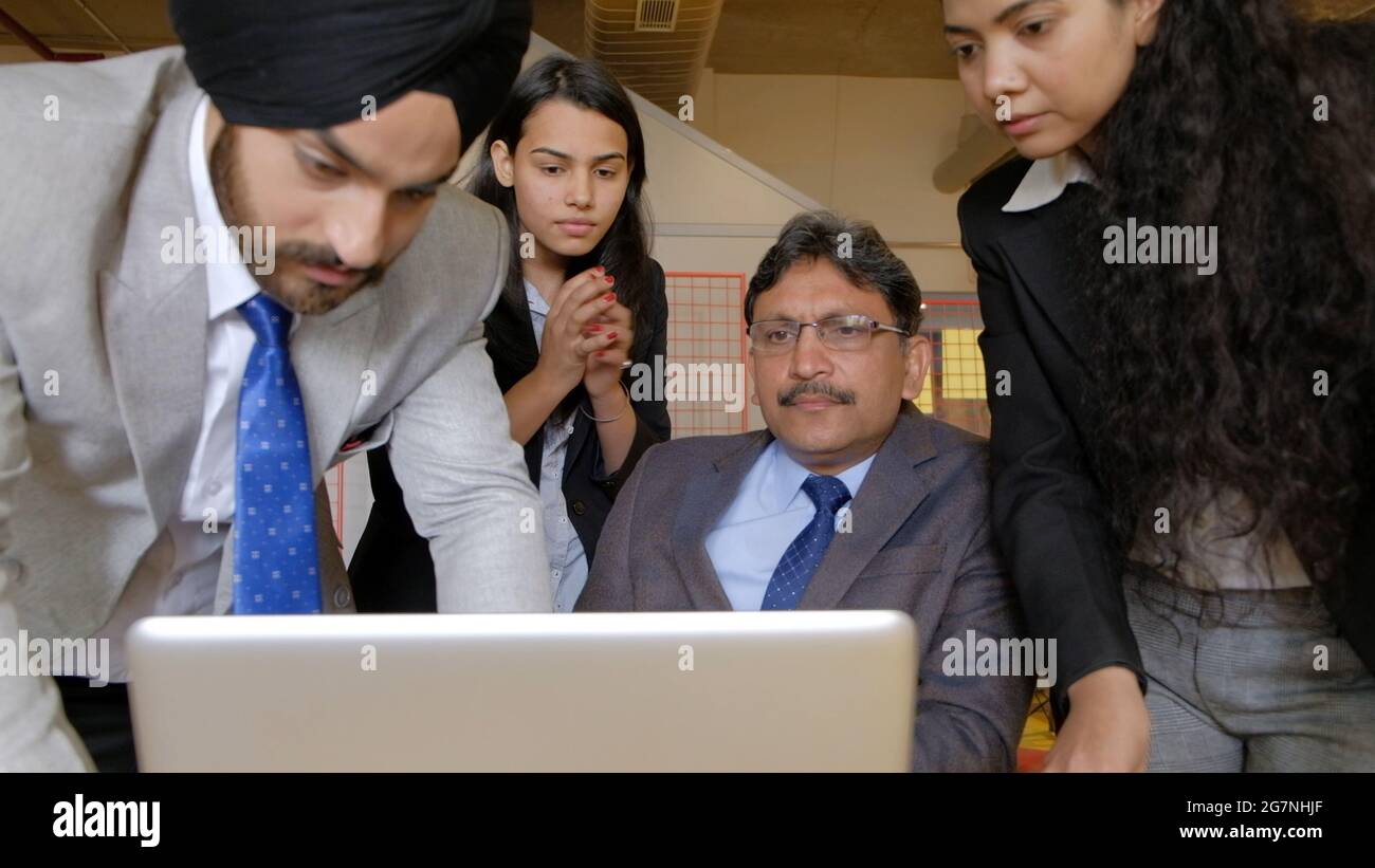 Closeup shot of a group of Indian people having a discussion in the ...