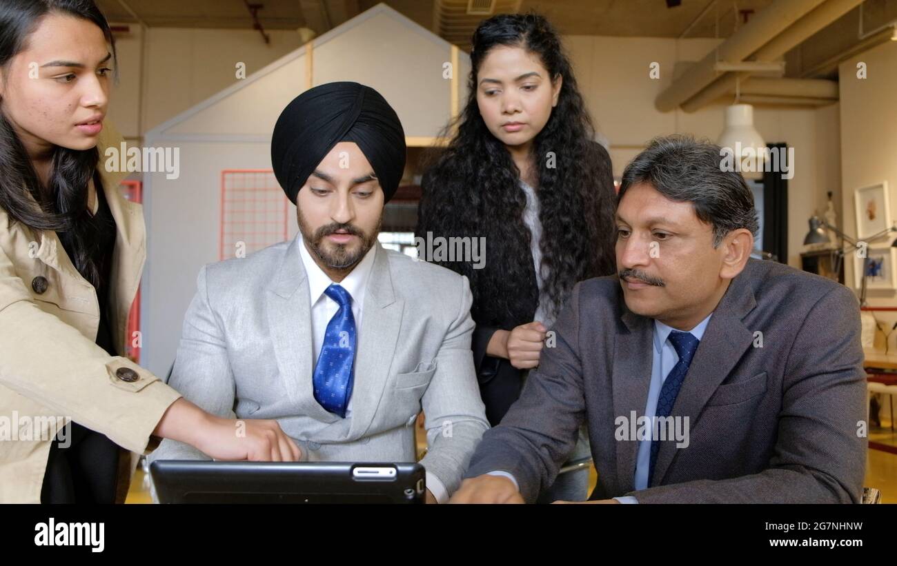 Closeup shot of a group of Indian people having a discussion in the ...