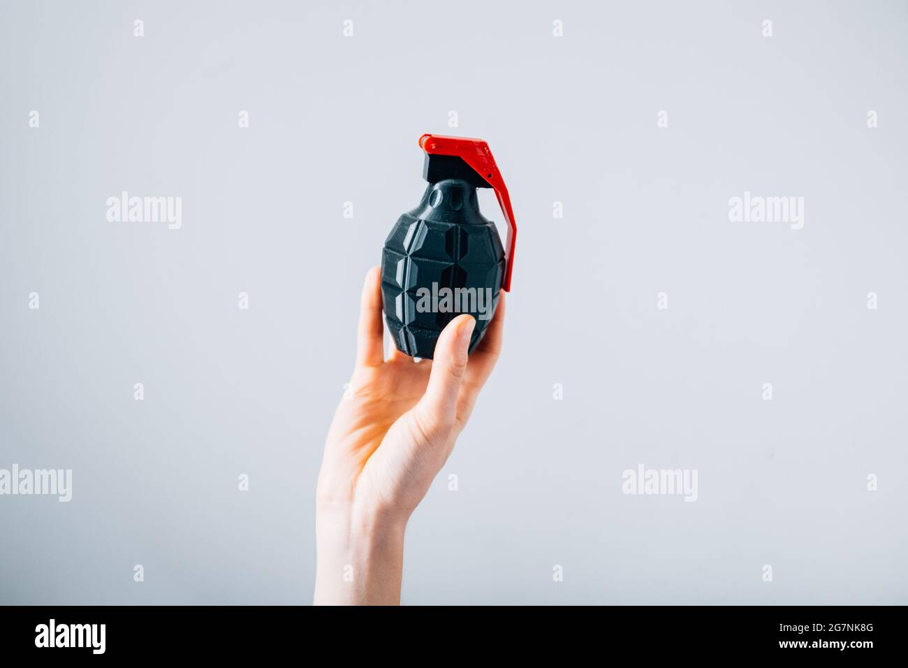 Hand holding hand grenade hi-res stock photography and images - Alamy