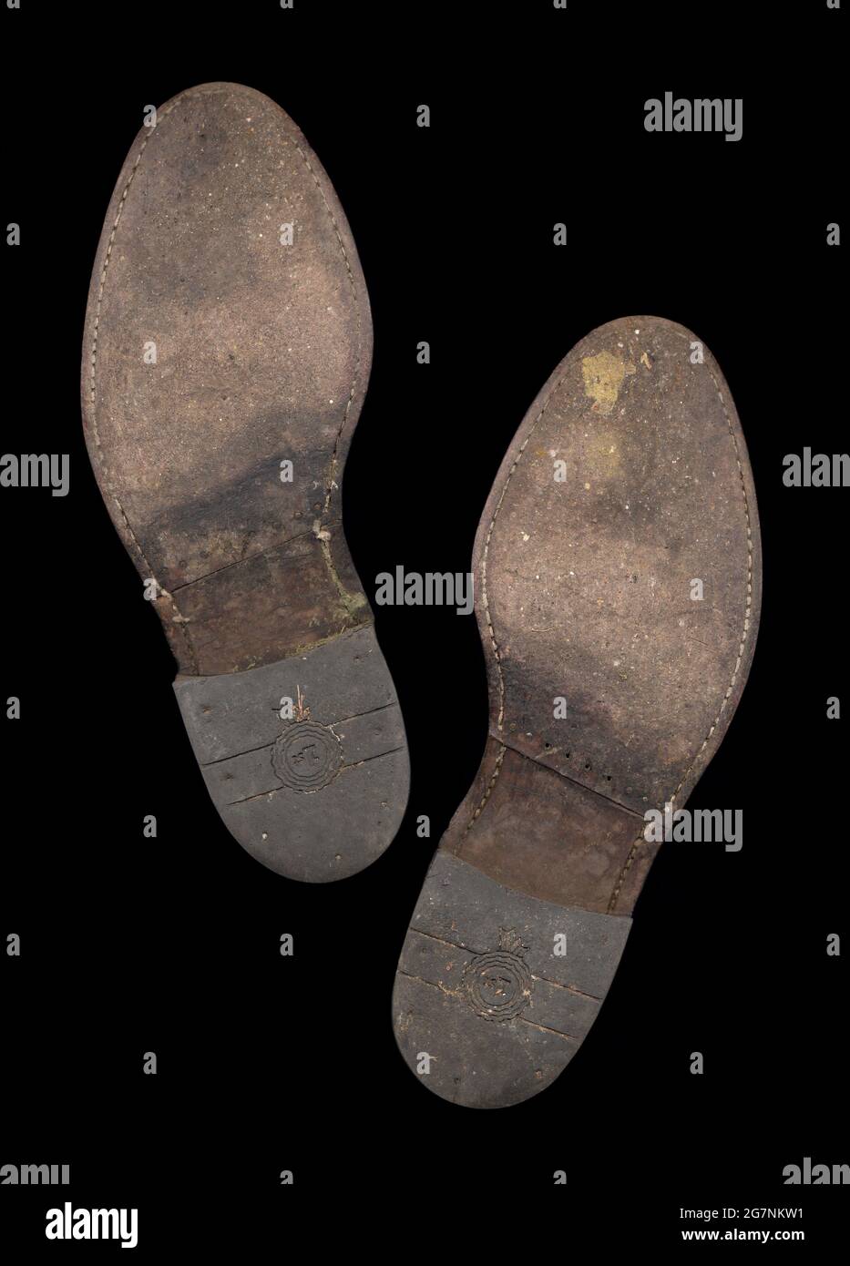 Soles of a pair of a man's worn shoes Stock Photo - Alamy