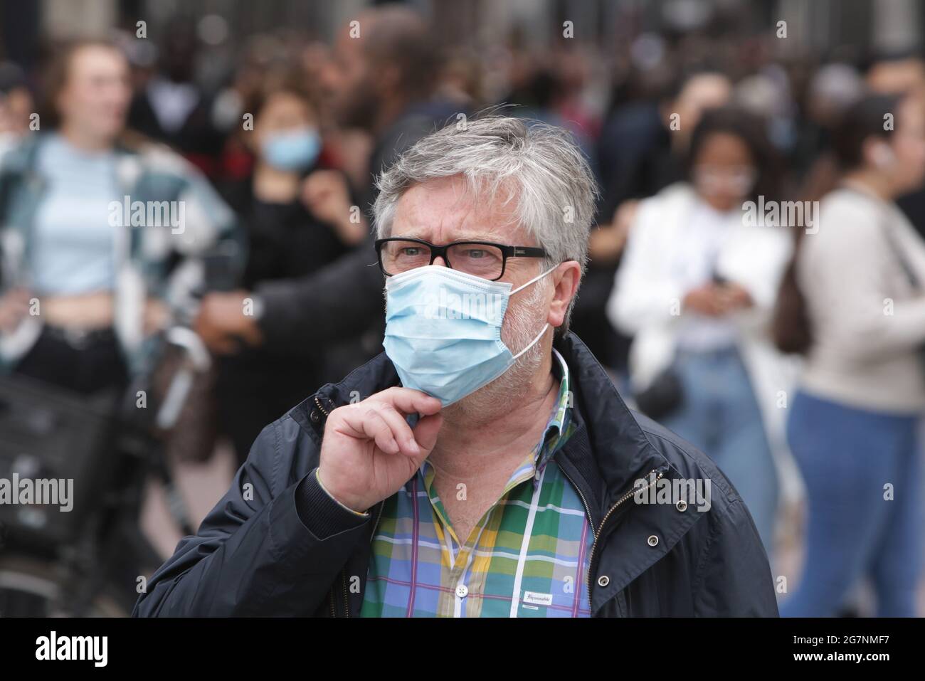 Amsterdam, Netherlands. 15th July, 2021. A tourist wearning protective ...