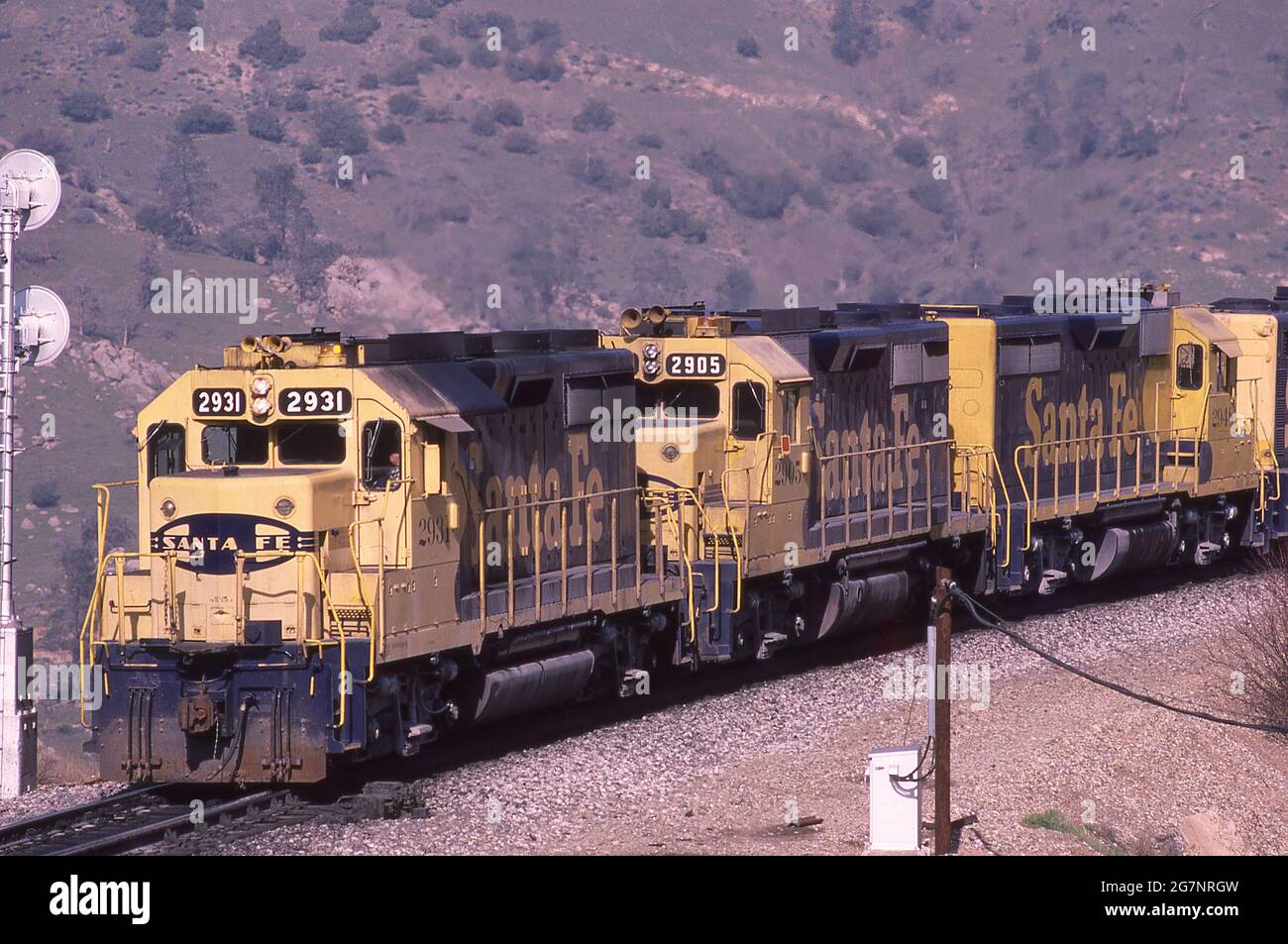 Walong, California, USA. Three GP35u diesel locomotives lead four units of a freight train, with ...