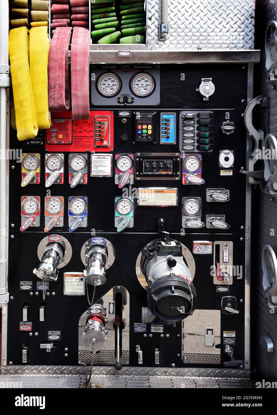 Multiple foam and water gauges and control valves on the side of a ...