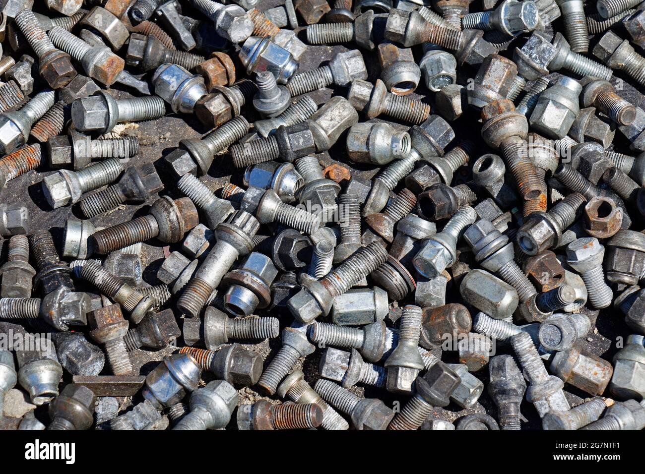 Large pile of silver metal screws used in transport industry Stock ...