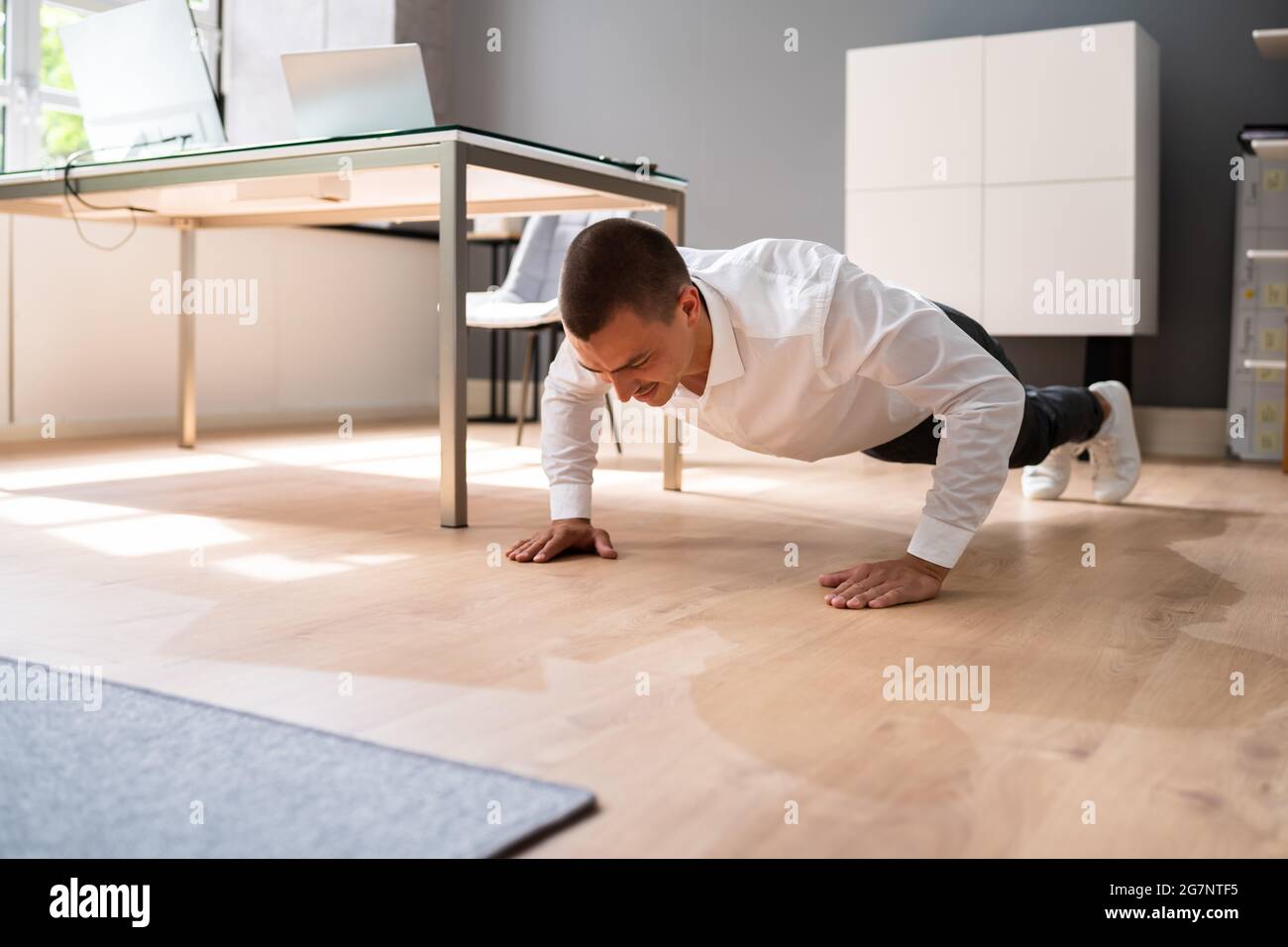 Healthy Yoga Exercise Workout In Office. Man Doing Push Ups Stock Photo ...