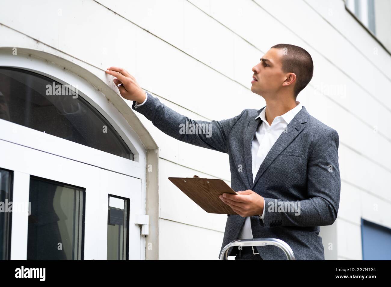Real Estate Property Appraisal. Man Inspecting House Stock Photo - Alamy