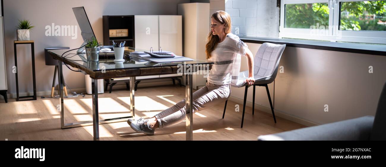 Triceps Dips Exercise Using Chair In Office Stock Photo - Alamy