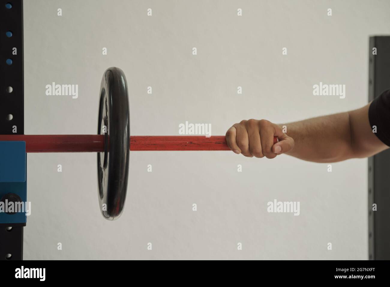 Hand of a male leaning on a barbell after a workout Stock Photo - Alamy