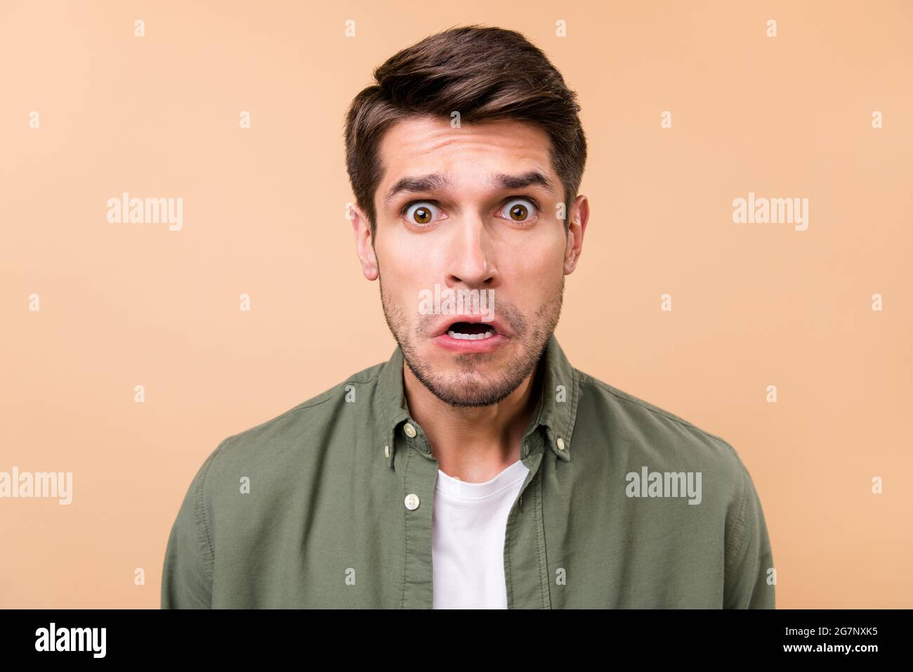 Photo of unhappy upset young man astonished stupor stare isolated on ...