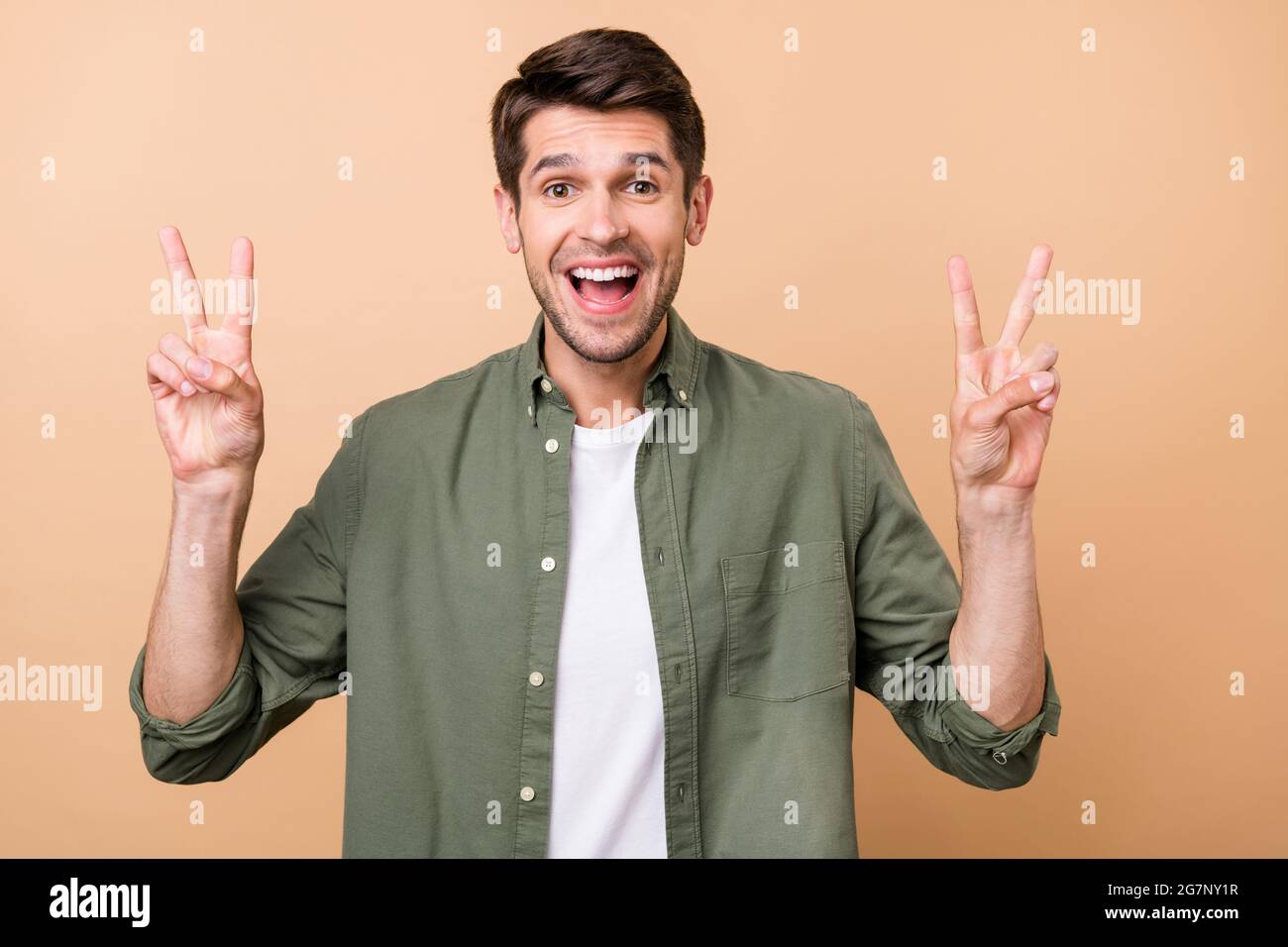 Photo of charming cheerful happy man make v-signs hello good mood ...