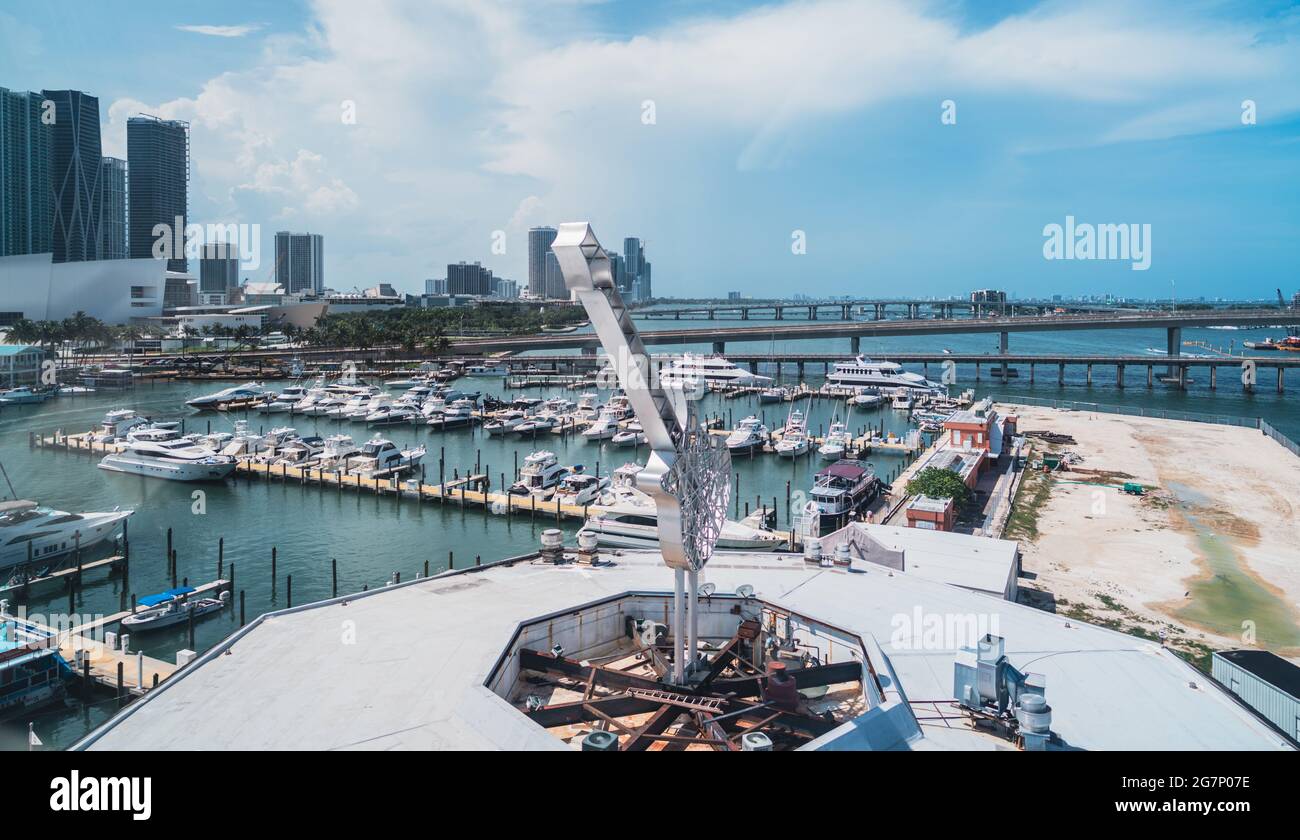 Horizontal view of large port full of ships and yachts with blue cloudy ...
