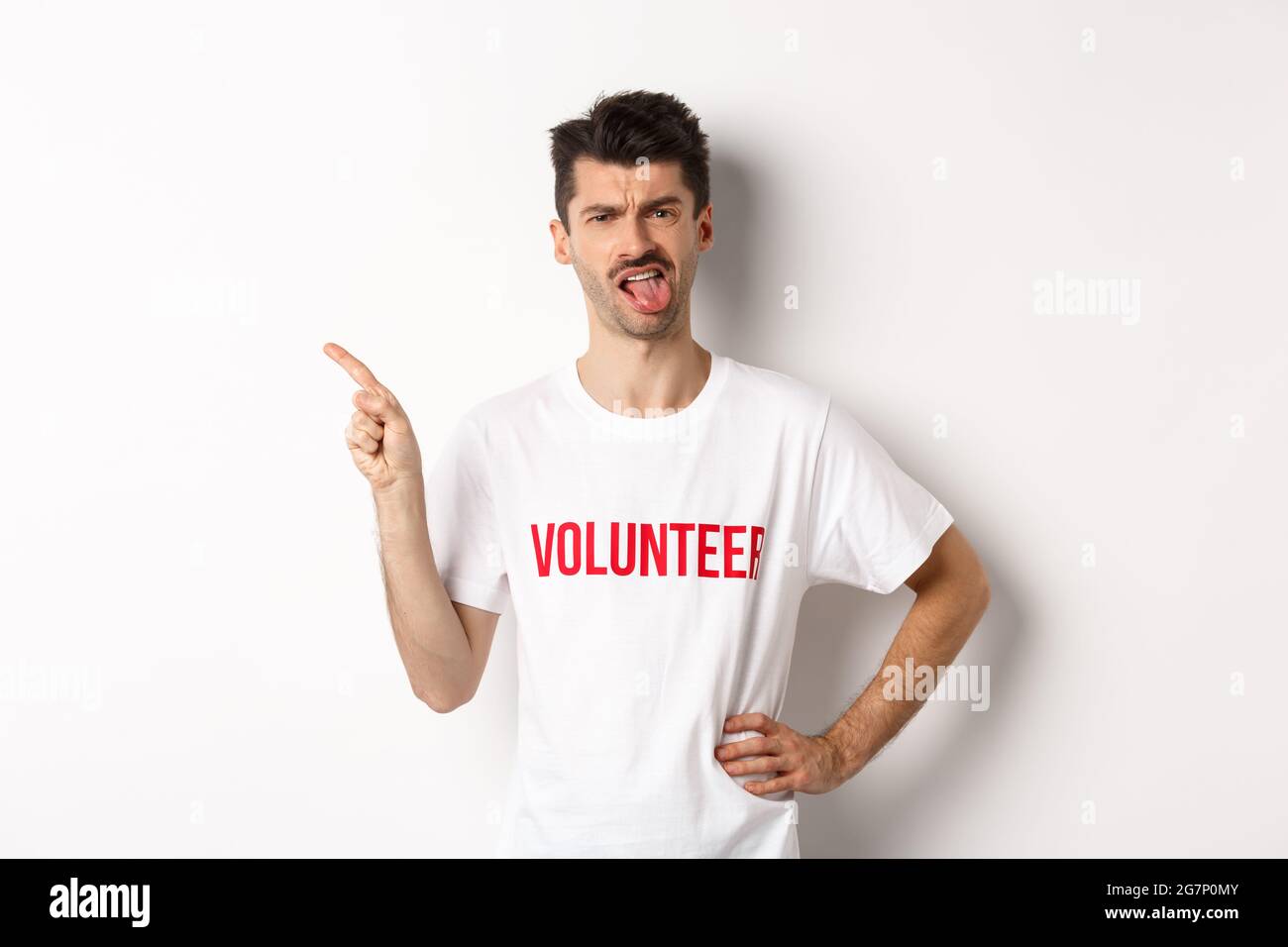 Disappointed volunteer showing bad promo offer, sticking tongue and ...