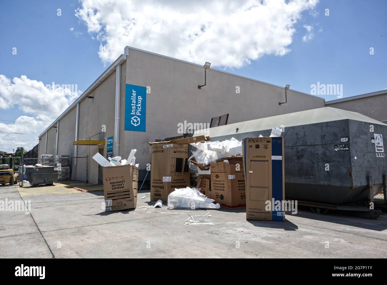 Augusta, Ga USA - 07 11 21: Piles of cardboard trash and waste behind a ...