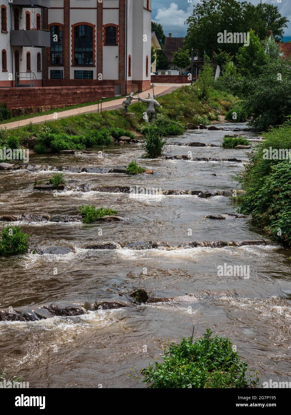 Powerful waterfall on the Kinzig river in Germany. Full-flowing river ...