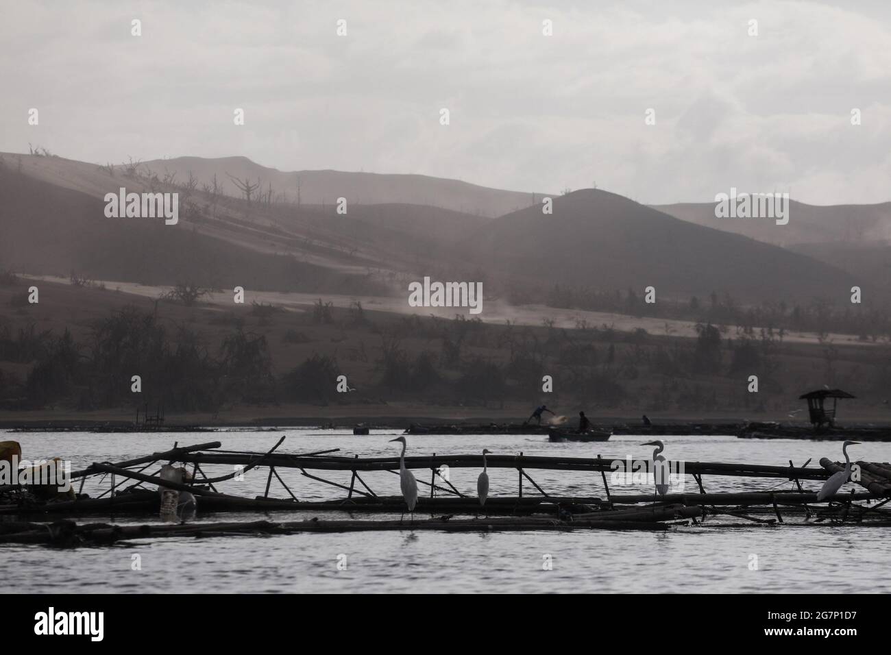 Taal volcano island is seen covered in volcanic ash as it contnues to ...