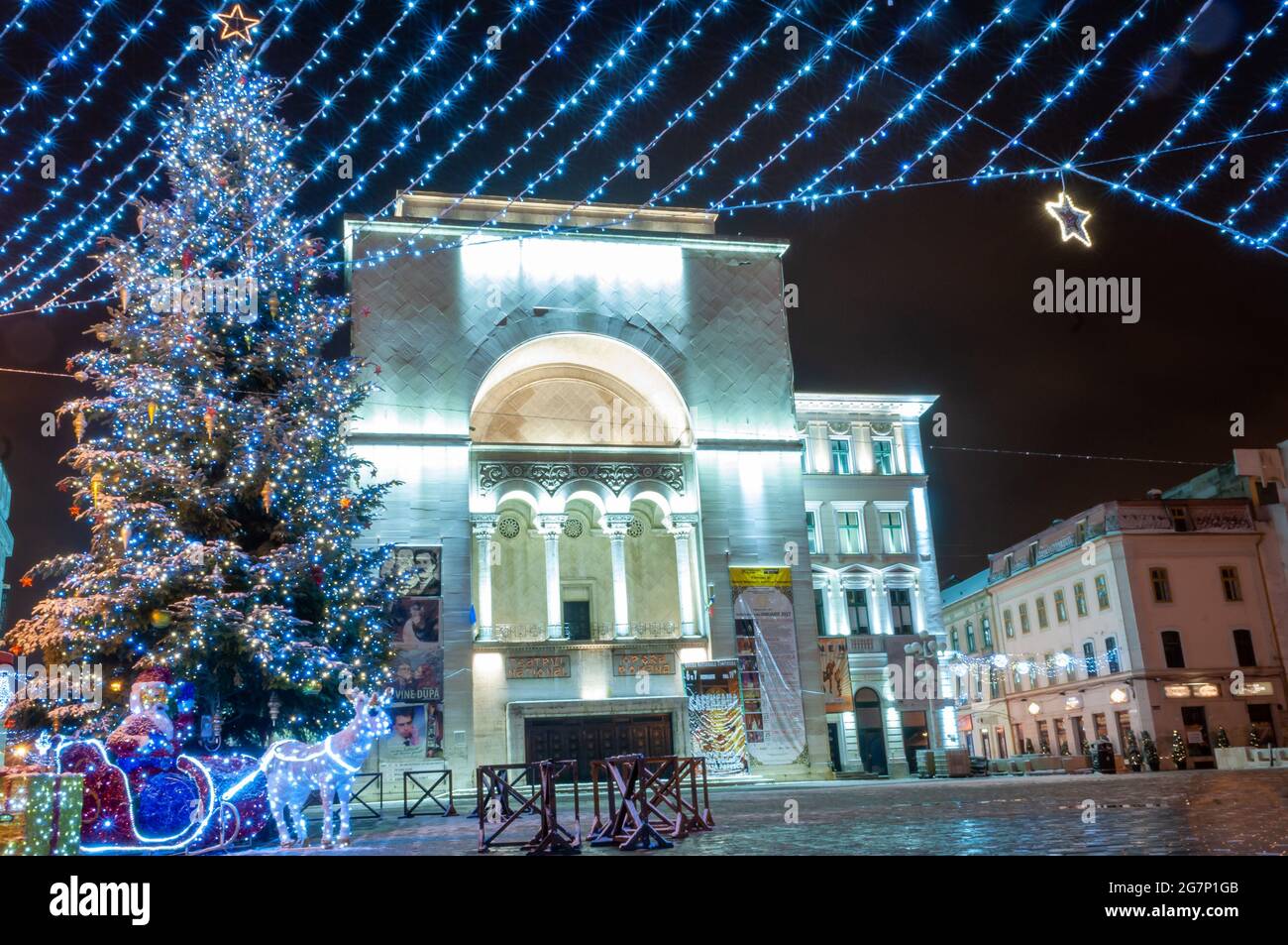 A view of a Christmas tree with the opera house in the background ...