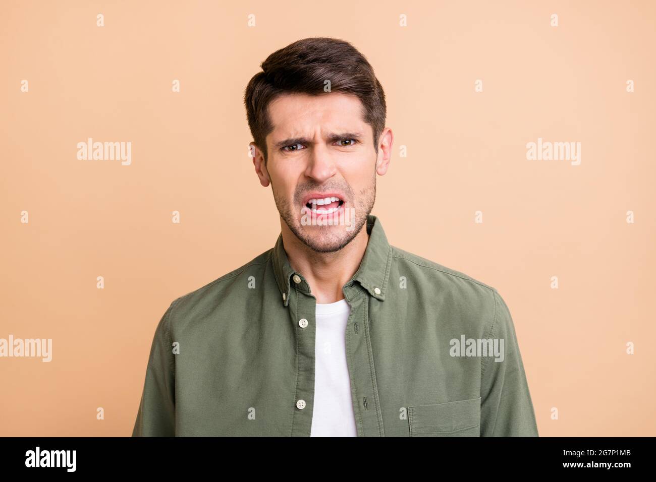 Photo of unhappy young sad man bad mood dislike wear casual green shirt ...
