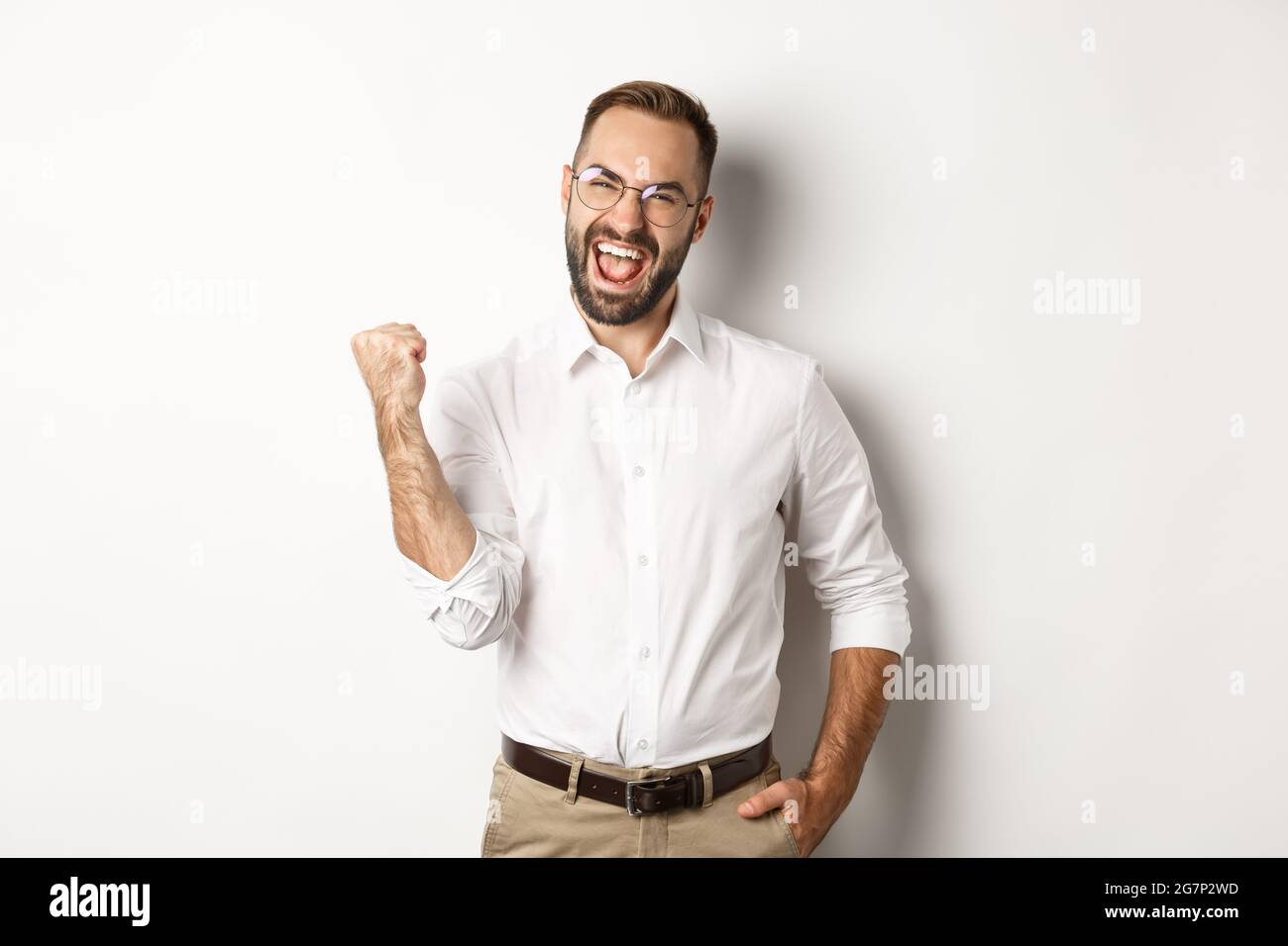 Successful businessman rejoicing, making fist pump and saying yes ...