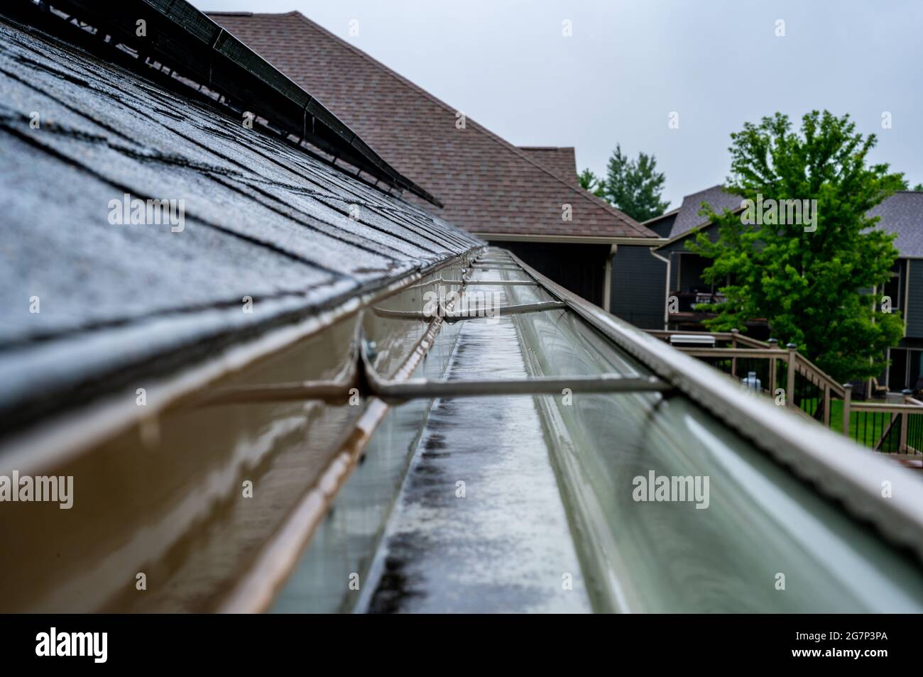 Selective focus on a section of residential guttering with hanger ...