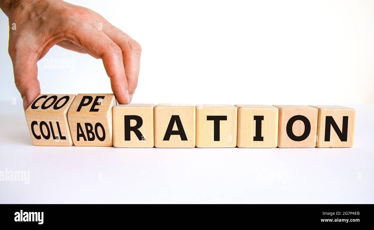 Cooperation or collaboration symbol. Businessman turns cubes, changes ...