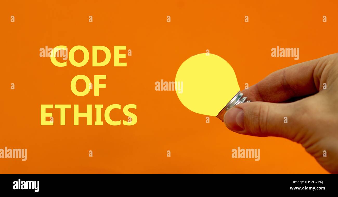 Code Of Conduct Symbol Businessman Holds Yellow Shining Light Bulb