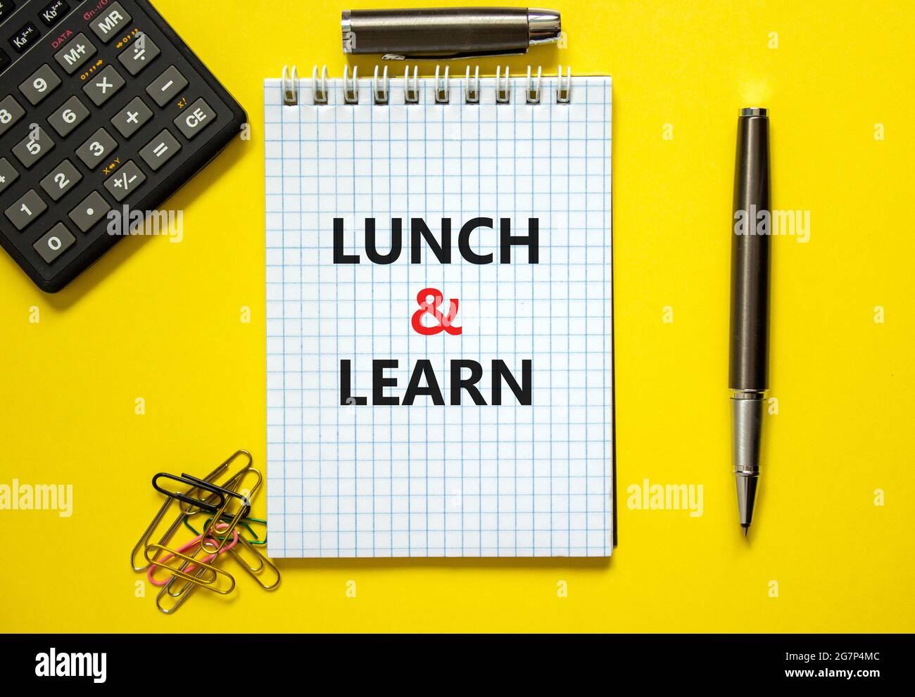 Lunch and learn symbol. Words 'Lunch and learn' on white note. Yellow ...